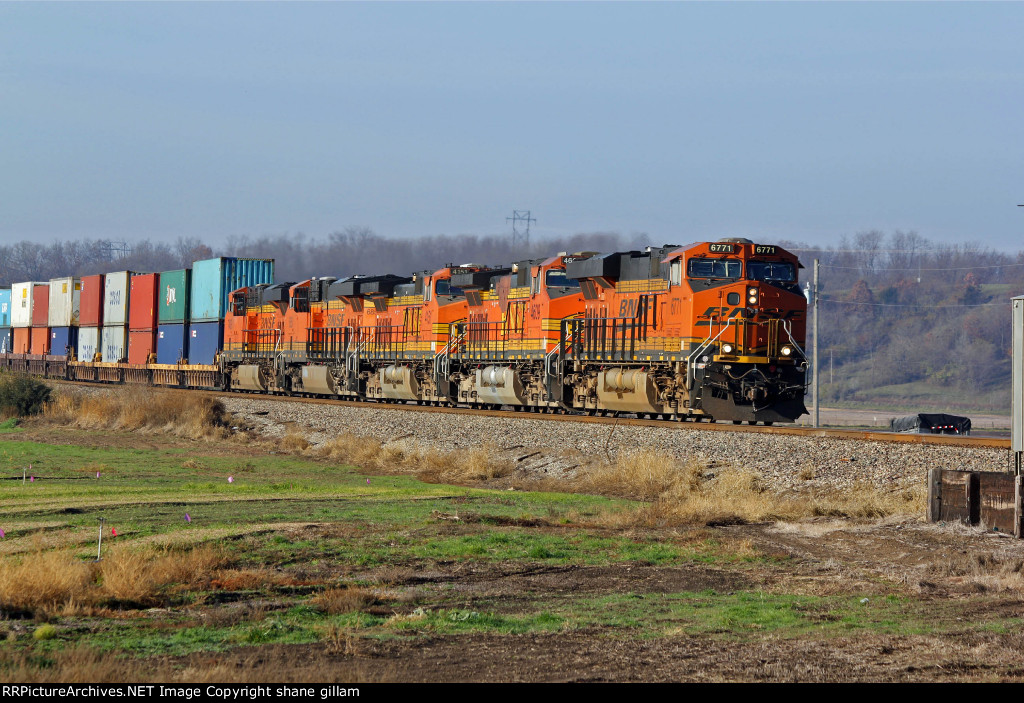 BNSF 6771 leads A hotshot stack train to Fort Mad Iowa.